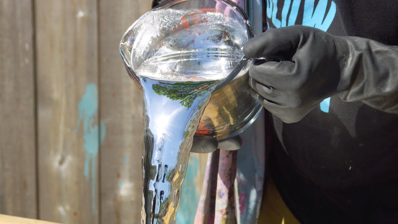 Pouring a liquid mirror in 4K slow motion