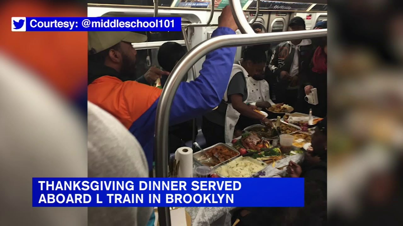 Thanksgiving feast hosted in middle of busy NYC subway car