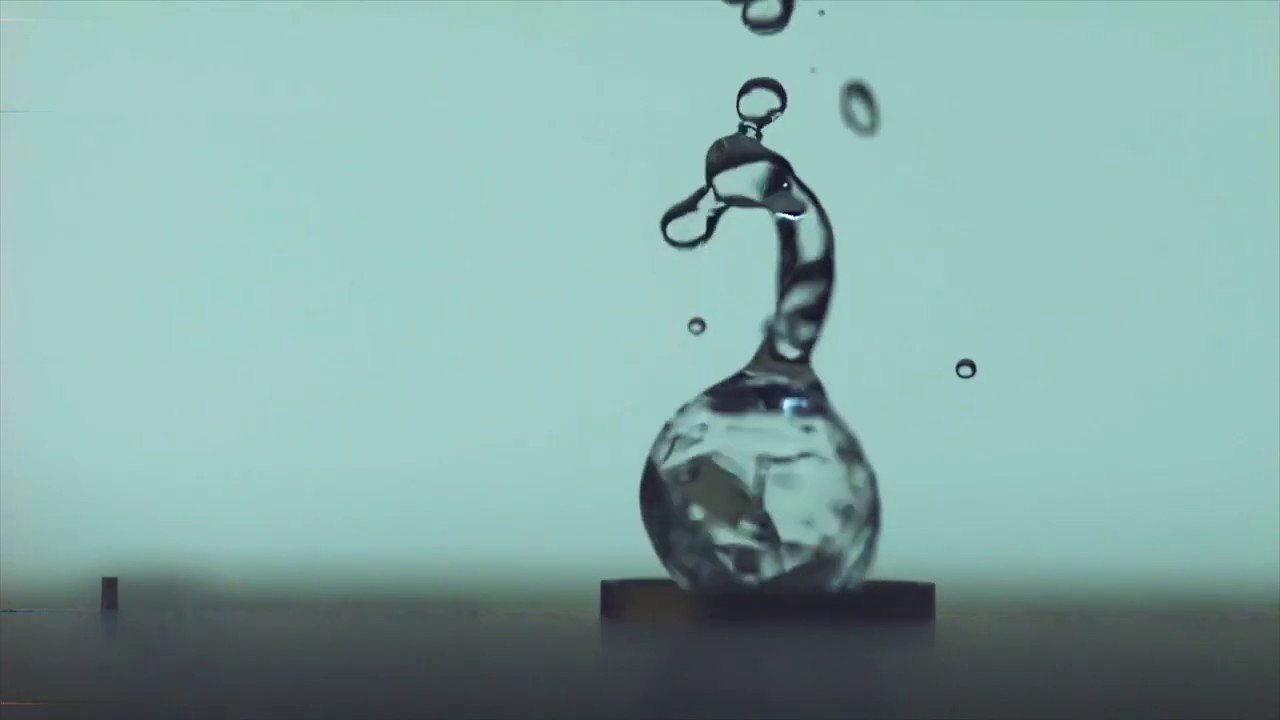 Extreme close-up of how water reacts on different surfaces