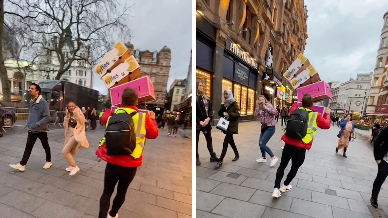 Guy tricks people with falling boxes.