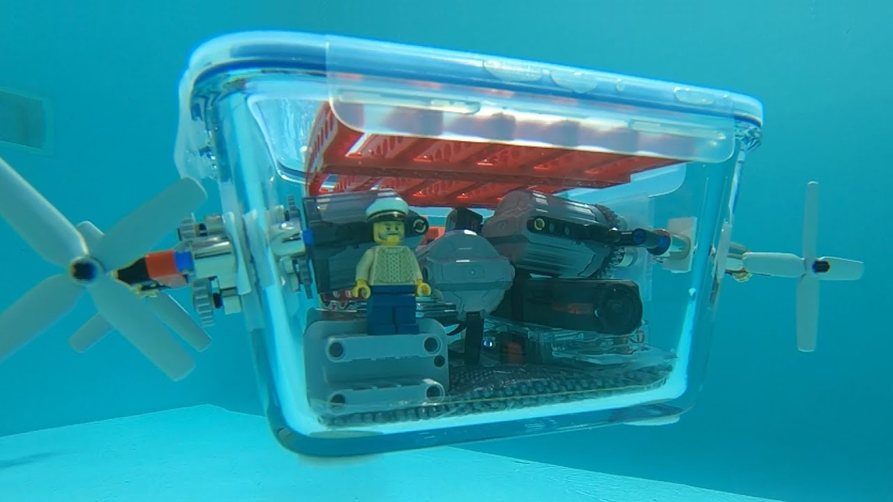Guy builds glass submarine with Legos and magnetic couplings
