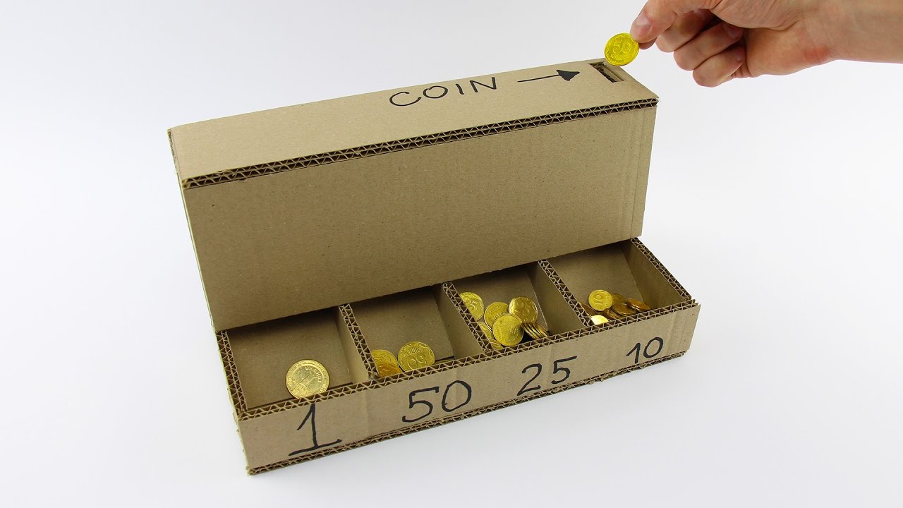 A DIY cardboard coin-sorter.