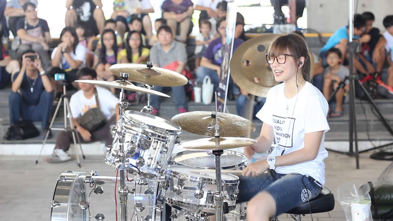 Young woman slays drums to 'Moves Like Jagger.'