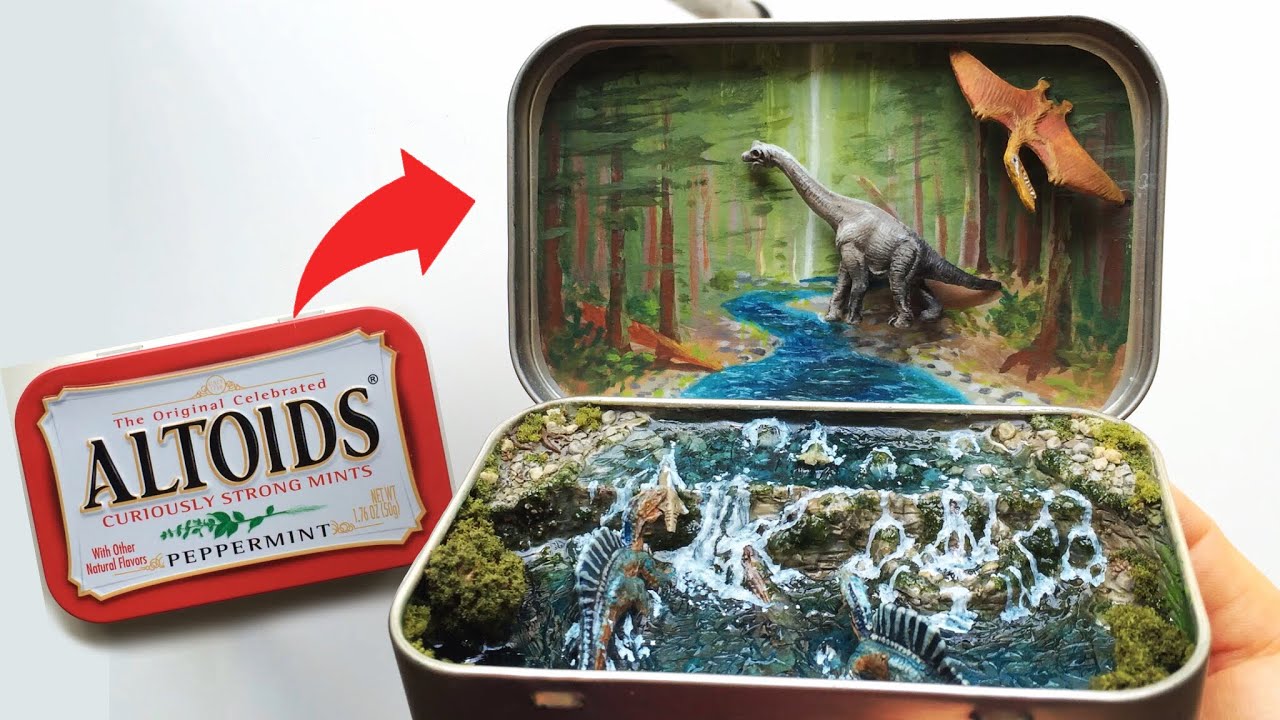 A tiny prehistoric scene inside Altoids tin