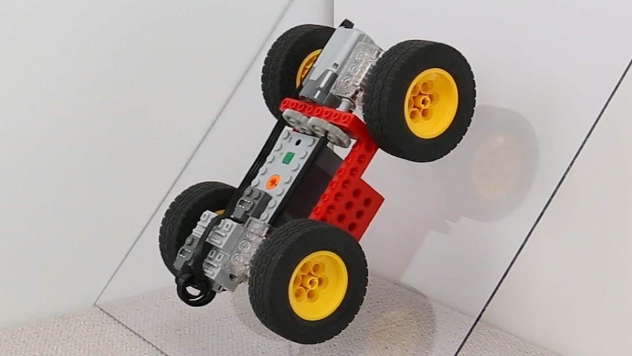 LEGO car climbs increasingly steep slopes.