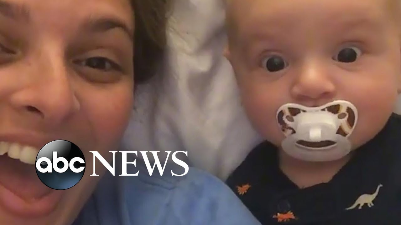 Baby excited to see mom in two places at once