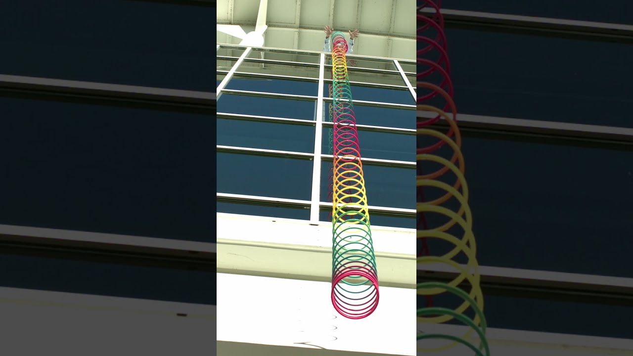 Watch how a slinky falls down in slow motion