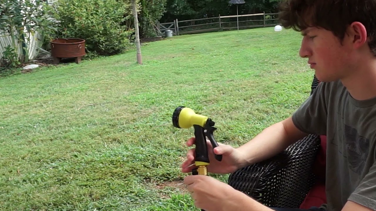 Musician using garden hose.