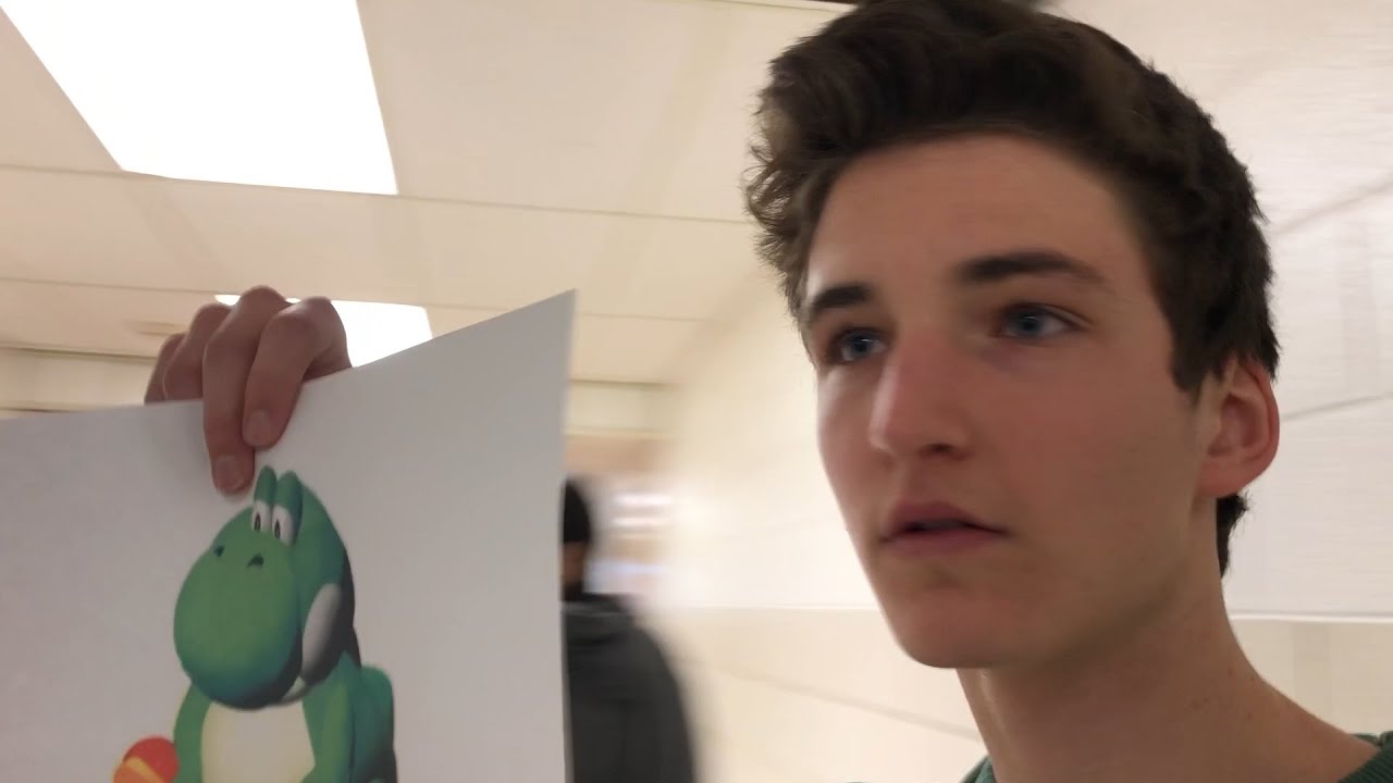 Kid follows classmates around with pictures of Yoshi.