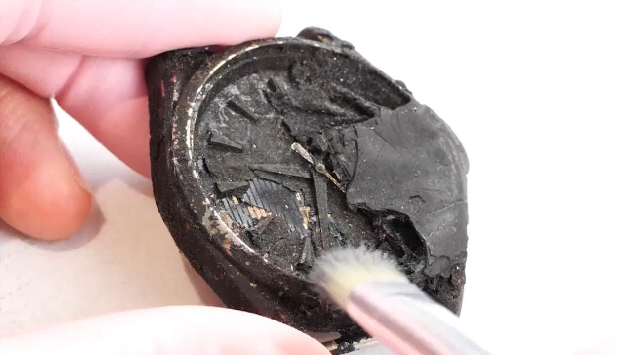 Incredible restoration of a burnt Omega watch.