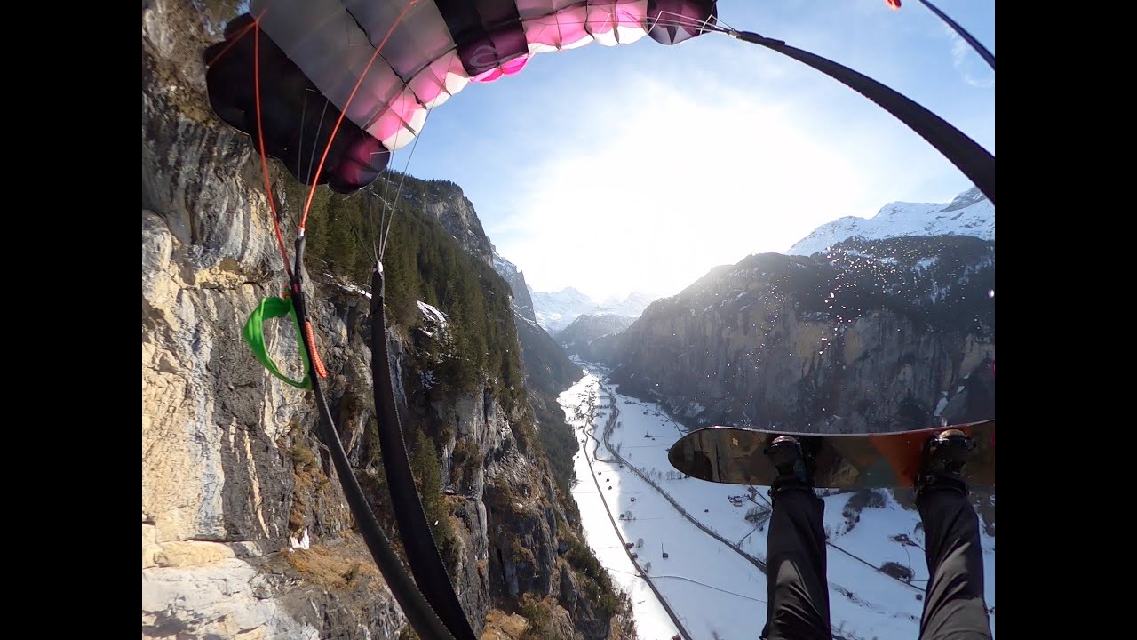 Snowboard base jump in the Swiss Alps.