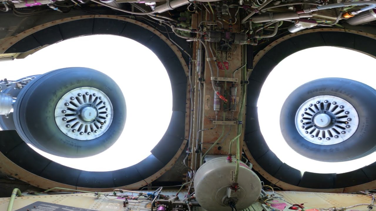 Landing gear movement as seen from inside plane.
