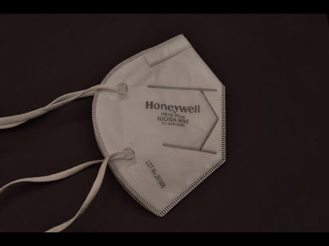 Face mask effectiveness under microscope.