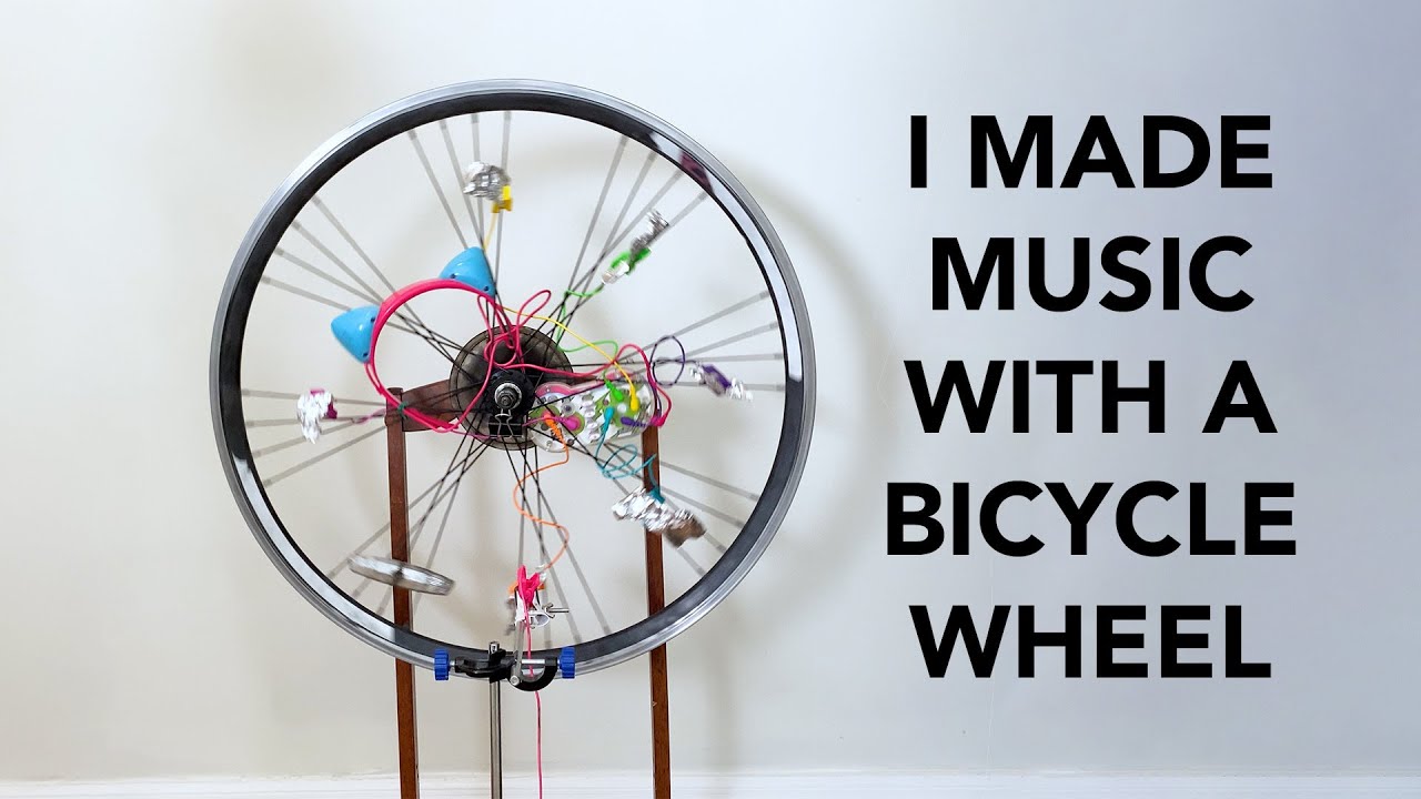 Creating music with a bicycle wheel.