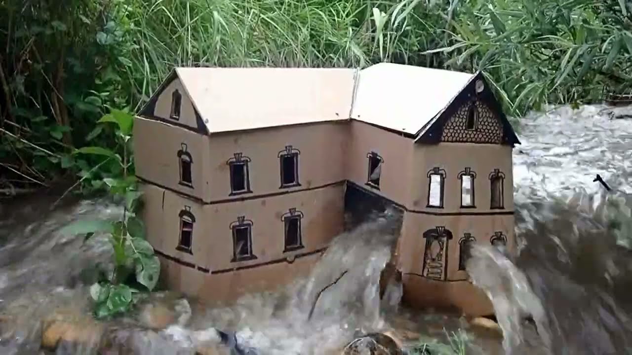 Cardboard house falls victim to flood.