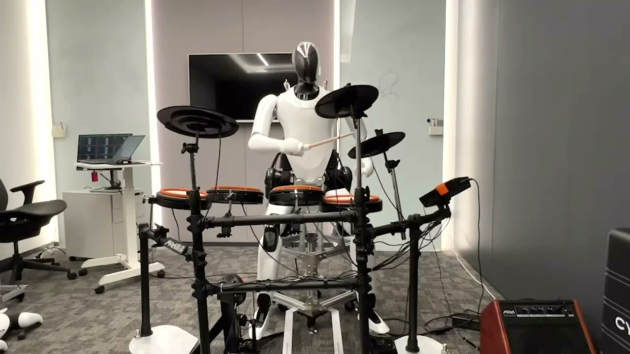 Watch humanoid robot drummer.