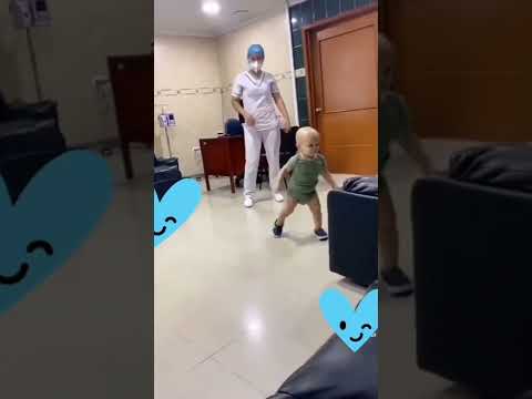 Toddler with cancer adorably invites nurse to dance.