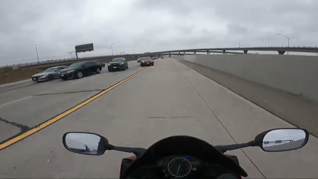 Driving against traffic to remove road debris.