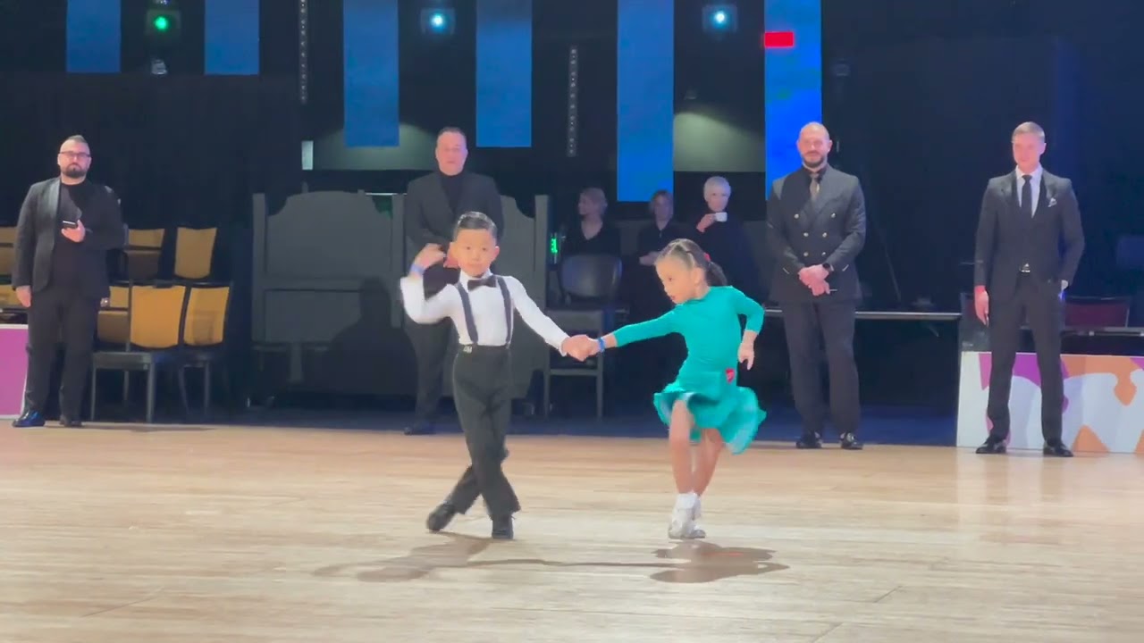 Adorable kids doing the cha-cha.