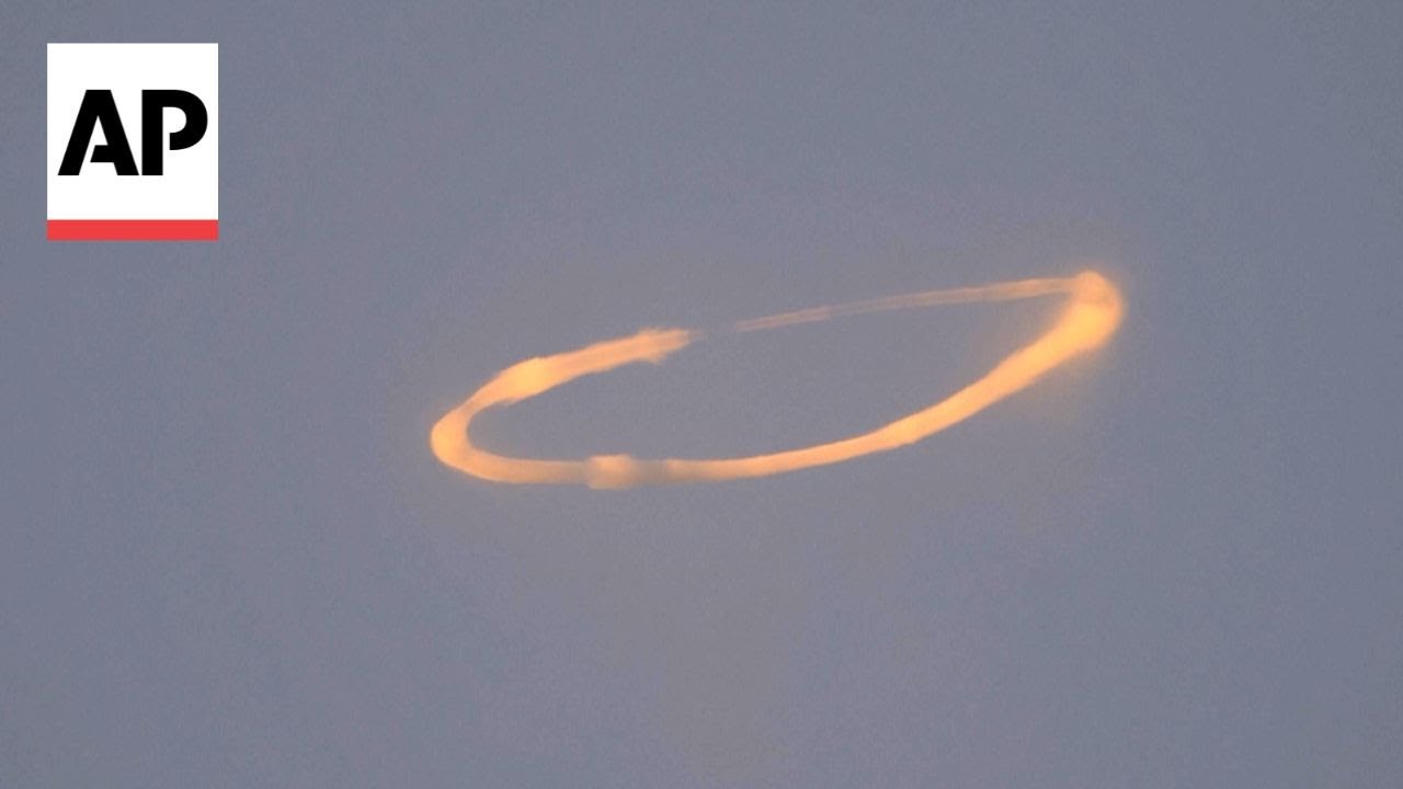 Mount Etna blows puffs perfect smoke rings.