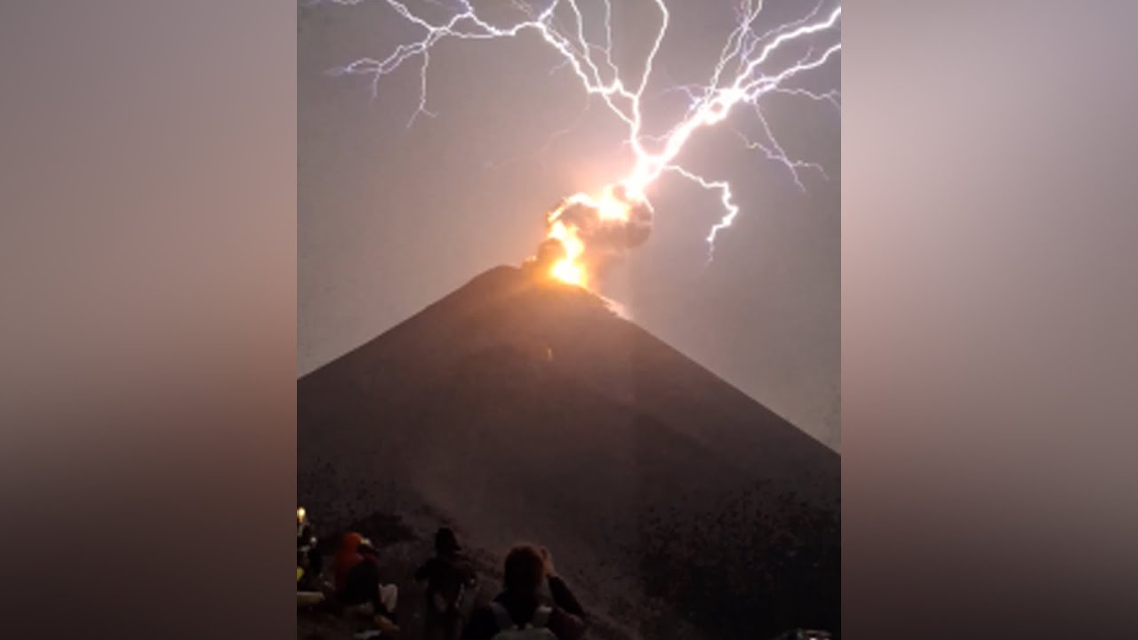 Lightning strikes erupting volcano.