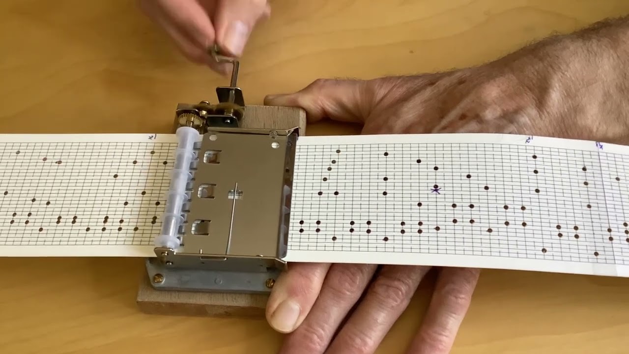 Card strip-playing music box.